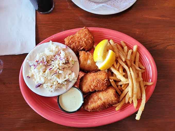 Golden fried fish with crispy coating and fries that actually look like they mean business on your plate.