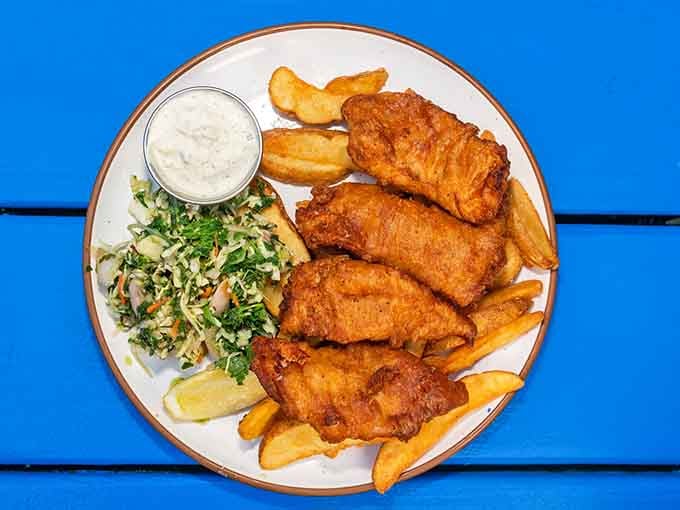 Golden, crispy perfection that proves fish and chips can be both comfort food and culinary art at the same time.