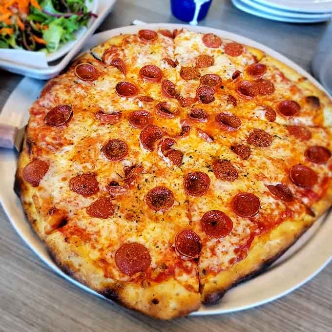 Pepperoni circles of joy covering melted cheese; this pizza knows exactly what it's doing and makes no apologies.