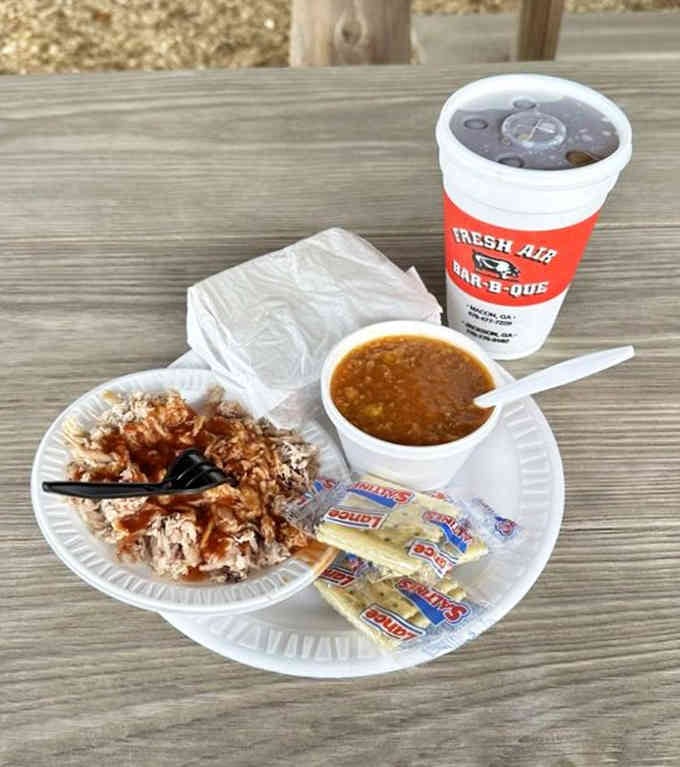 Pulled pork so tender it surrenders to your fork, paired with Brunswick stew that's been perfected over generations.