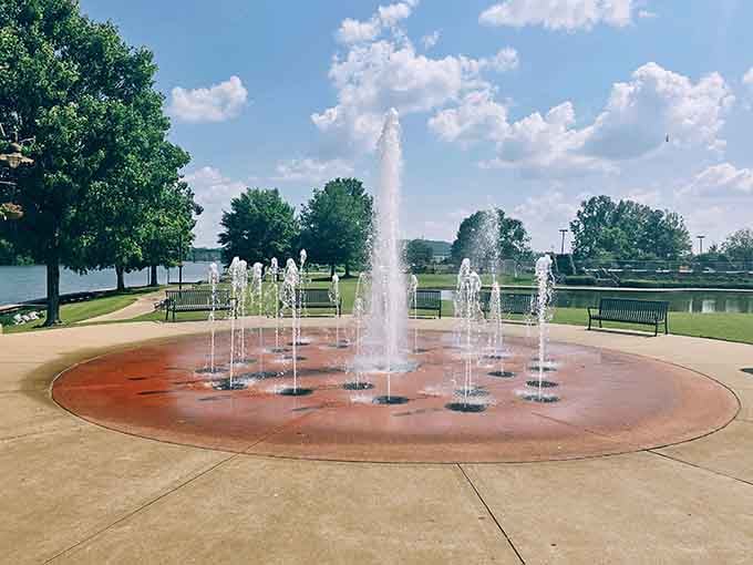 Kids cool off at the splash pad while parents contemplate how much money they're saving by not living somewhere ridiculous.