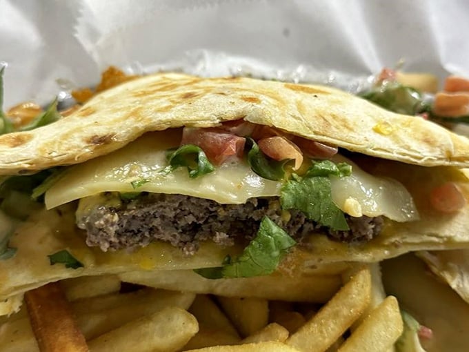 The Quesadilla Burger proves that sometimes the best ideas come from refusing to choose between two favorites.