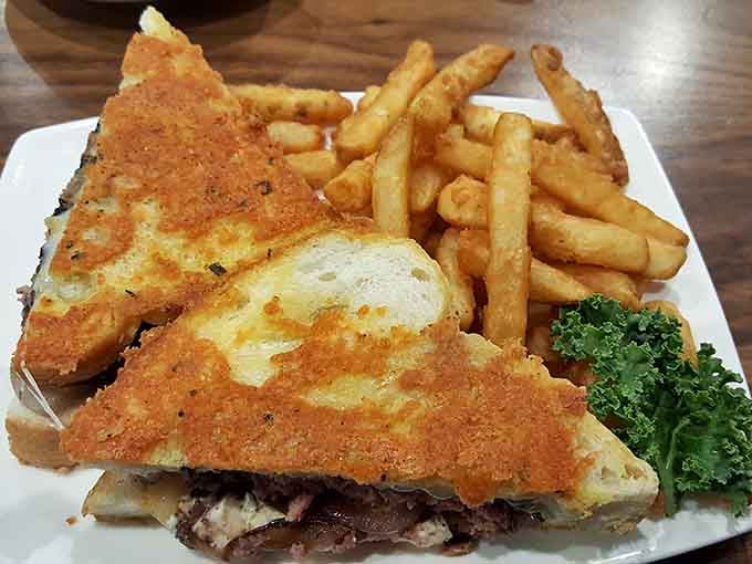 This patty melt achieves what every diner sandwich aspires to: perfectly melted cheese, crispy bread, and fries worth fighting over.