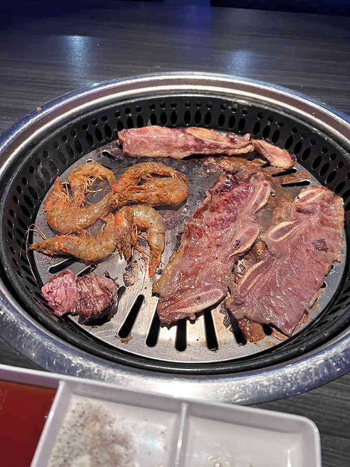 Shrimp and steak sizzling together on the grill, creating a surf-and-turf symphony that would make any chef jealous.