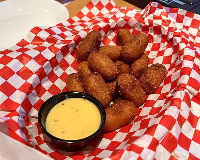 Golden corn dogs served in classic checkered baskets&mdash;because some presentation styles never go out of fashion.
