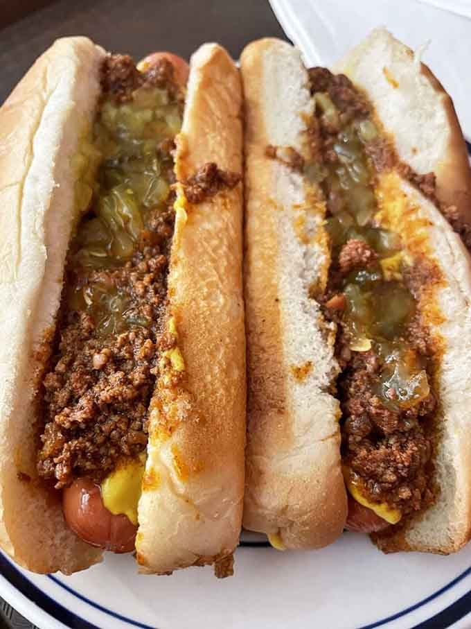 Behold the chili dog in its natural habitat, topped with meat sauce and relish that's been making taste buds sing since your grandparents were dating.