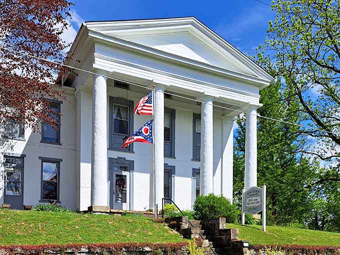 Classical columns and American flags, because some buildings know how to make an entrance without being obnoxious about it.