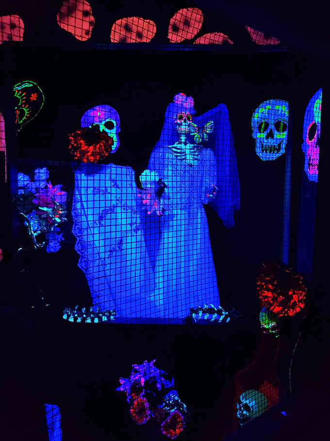 These neon skeletons glow brighter than your aunt's Christmas decorations, and they're infinitely more entertaining to look at.