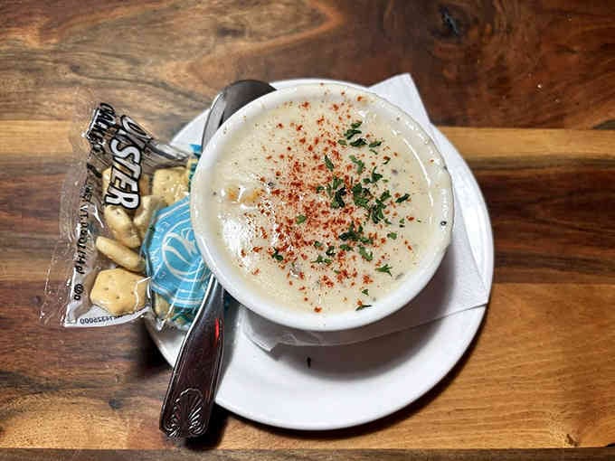 Behold the legendary chowder, topped with paprika and herbs, served with crackers like edible treasure maps.