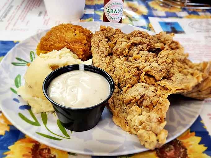 Golden fried mushrooms with cream gravy prove that vegetables can be just as indulgent as any steak.