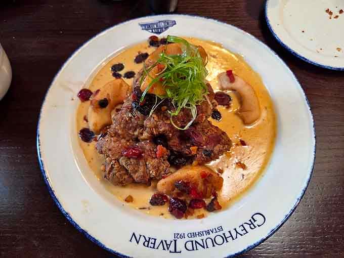 This isn't your average breaded pork; it's a golden-brown masterpiece that laughs at the concept of fitting on a bun.