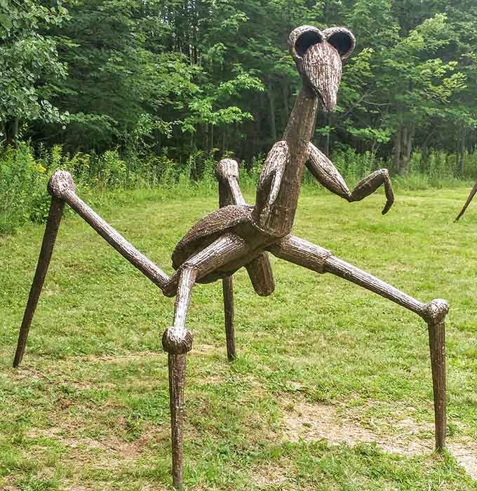 A praying mantis sculpture that's equal parts whimsical and slightly unsettling, in the most delightful way possible.