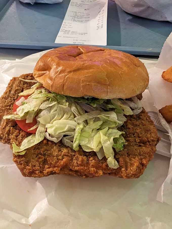 This breaded tenderloin is so gloriously oversized, the bun looks like it's given up on life entirely.