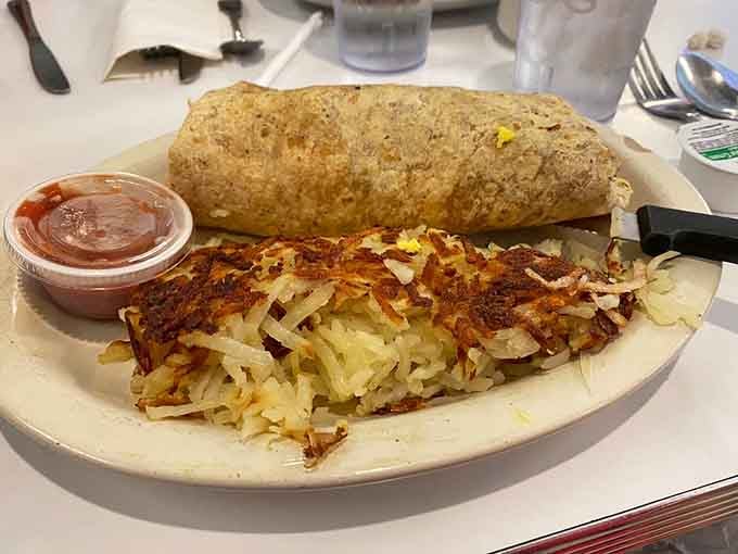That breakfast burrito paired with perfectly crispy hash browns is the kind of plate that starts mornings right.