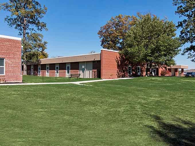 Clean brick buildings and manicured lawns showing that affordable living doesn't mean sacrificing quality or community pride.