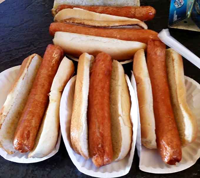 Deep-fried hot dogs lined up like golden soldiers ready to deliver maximum flavor with every crispy bite.
