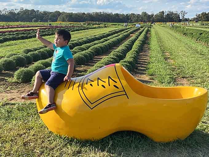 Nothing says "photo opportunity" quite like a giant yellow wooden shoe that fits approximately one very ambitious family or several confused adults.
