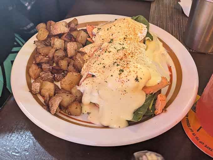 Salmon Benedict draped in hollandaise with perfectly crispy home fries is basically edible sunshine on a plate.