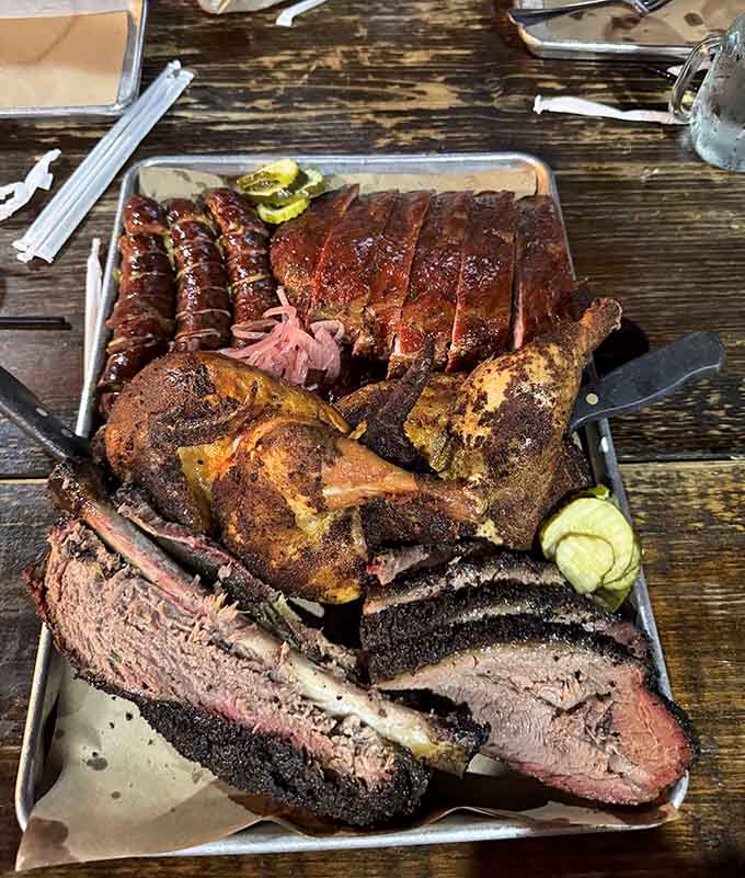 When your platter arrives looking like this, you understand why people drive across state lines for barbecue.
