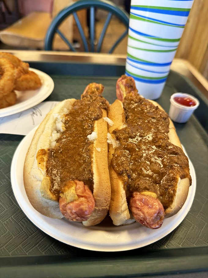 Two Texas Wieners drowning in chili sauce&mdash;proof that sometimes the best things in life come in pairs.