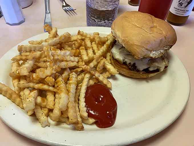 A burger and fries that prove lunch here is just as serious as breakfast, no participation trophies.