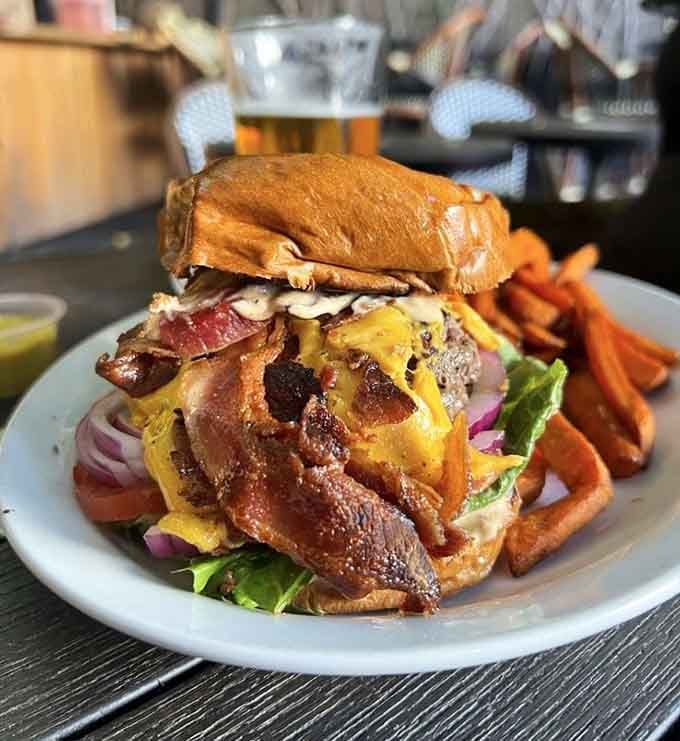 This burger towers higher than your self-control, and honestly, that's exactly how brunch should work in a barrel.