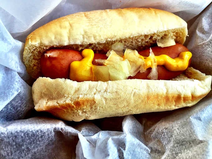 Behold the classic: mustard, onions, and a perfectly grilled frank that snaps when you bite into it, perfection achieved.