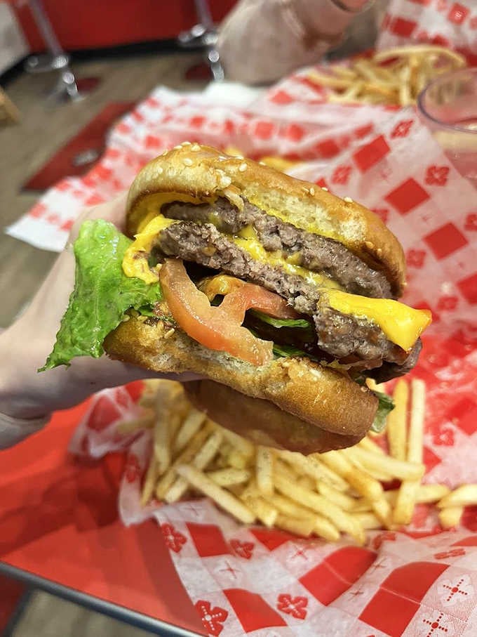 Two patties stacked high with melted cheese, because moderation is overrated when you're already committed to happiness.