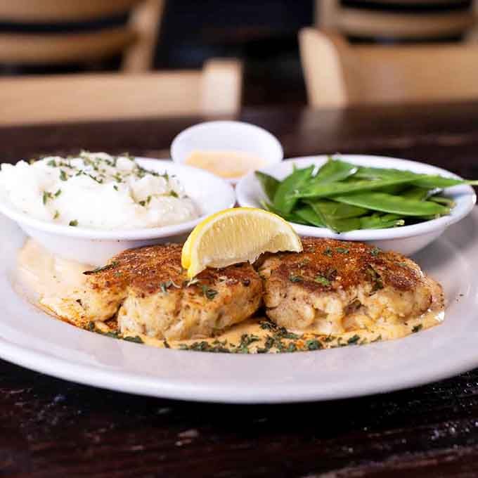 Those crab cakes aren't playing around, golden and generous with actual crab instead of sad filler material.