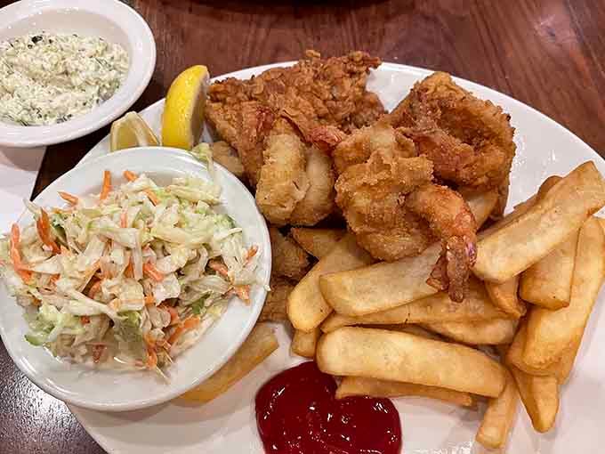 Golden fried shrimp with crispy fries and creamy coleslaw, this is what seaside dreams are made of, landlocked edition.