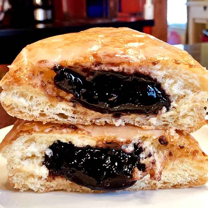 That jelly filling isn't playing around, folks. This is what commitment to donuts looks like in cross-section form.