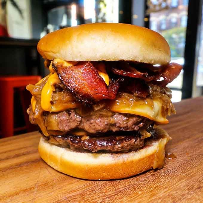 Double patties stacked with bacon and cheese prove that sometimes more is exactly what the doctor didn't order.
