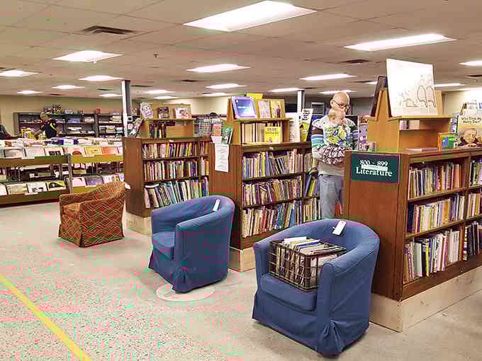 Cozy reading chairs invite you to preview your potential purchases in this bibliophile's paradise of endless literary possibilities.