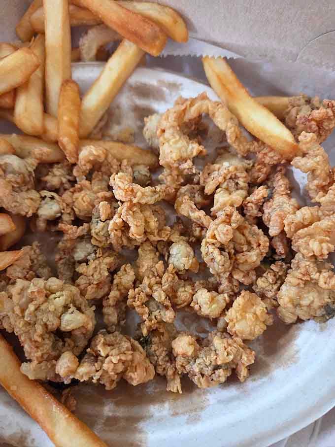 Golden fried clams piled high with crispy fries prove that simple perfection never goes out of style or fashion.