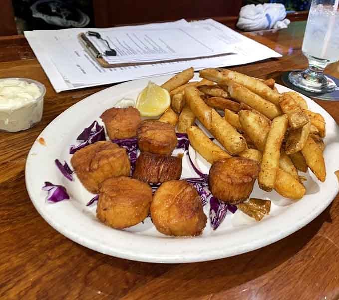 Golden scallops and crispy fries prove that sometimes the simplest preparations let quality ingredients shine brightest on your plate.