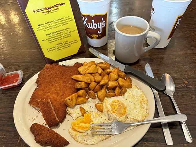 Golden schnitzel so perfectly breaded it looks like edible sunshine decided to hang out with eggs and potatoes.