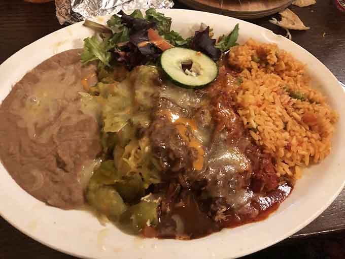 Behold the plate that launched a thousand return trips&mdash;enchiladas, rice, beans, and a side salad ready for action.