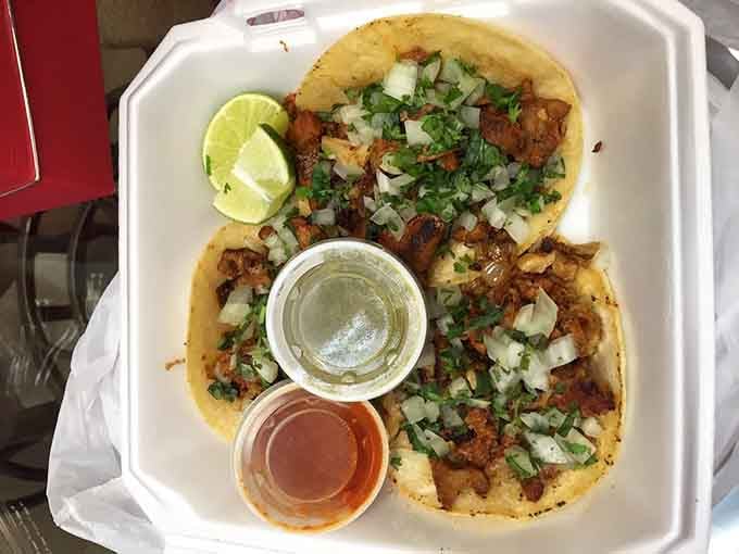 Al pastor tacos arrive with perfectly marinated pork, fresh cilantro, and enough flavor to make you forget the outside.