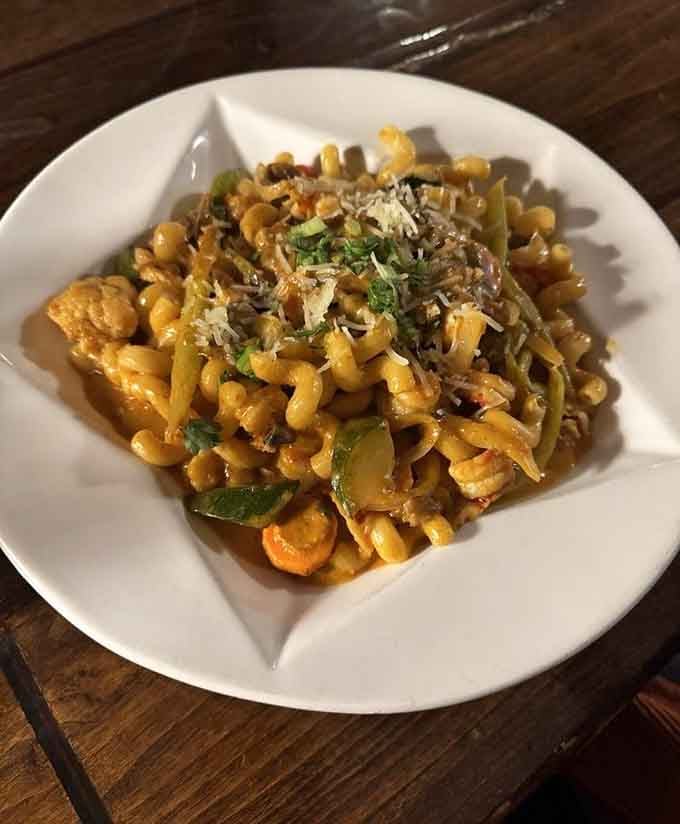 Pasta gets the Cajun treatment with bold spices and fresh vegetables dancing together in perfect harmony on your plate.