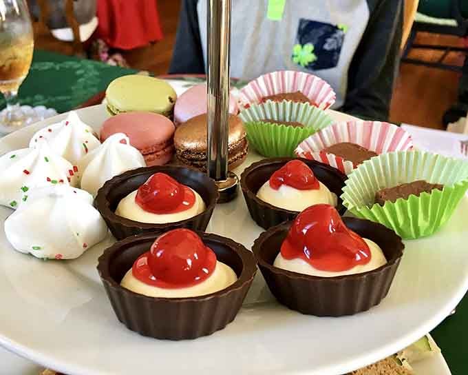 These chocolate dessert cups topped with glossy cherries and macarons look almost too pretty to eat. Almost.