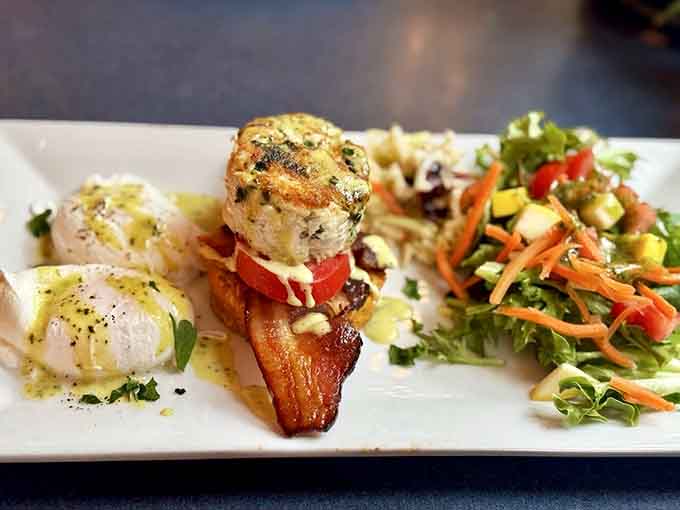 Crab cake Benedict perched on a sweet potato biscuit, because regular English muffins are officially too boring now.