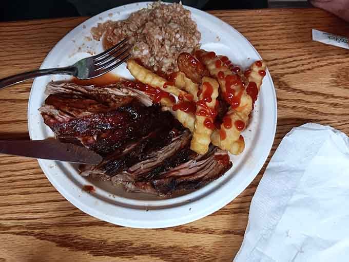 When ribs meet waffle fries and red slaw, it's like the Beatles reuniting but way more delicious.