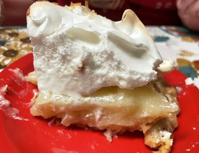 Coconut cream pie so tall it needs its own zip code, with meringue that could double as a cloud.