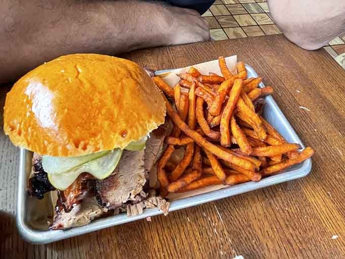 That brisket sandwich at Local Smoke BBQ comes with sweet potato fries and zero regrets about your life choices.