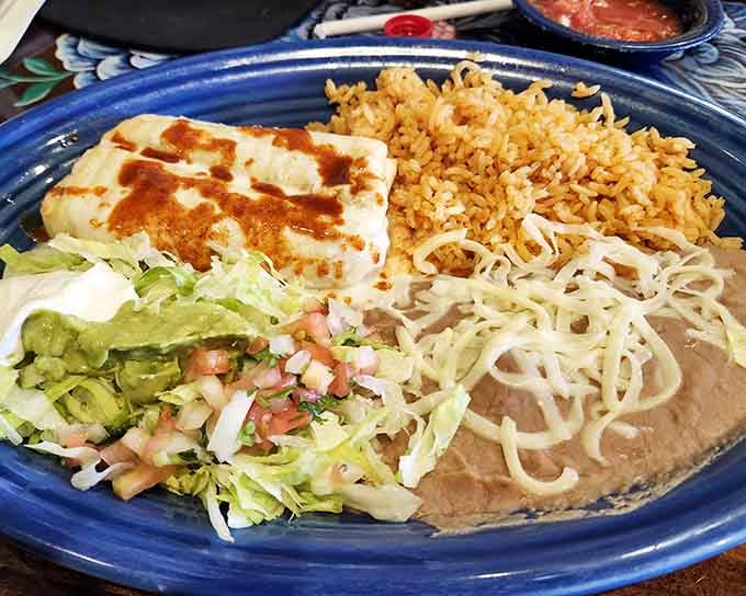 That golden chimichanga sitting next to perfectly seasoned rice is the kind of plate that makes you forget about everything else happening.