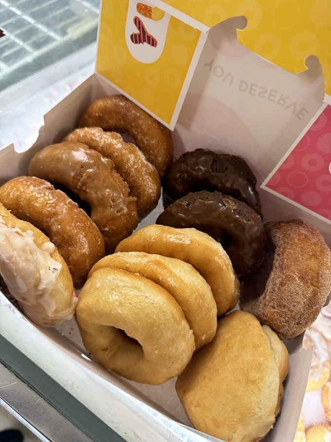 A box of mixed donuts that looks like it was assembled by someone who understands the assignment: variety, freshness, pure happiness.