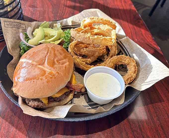 A juicy burger paired with golden onion rings proves that sometimes the classics are classic for a reason.
