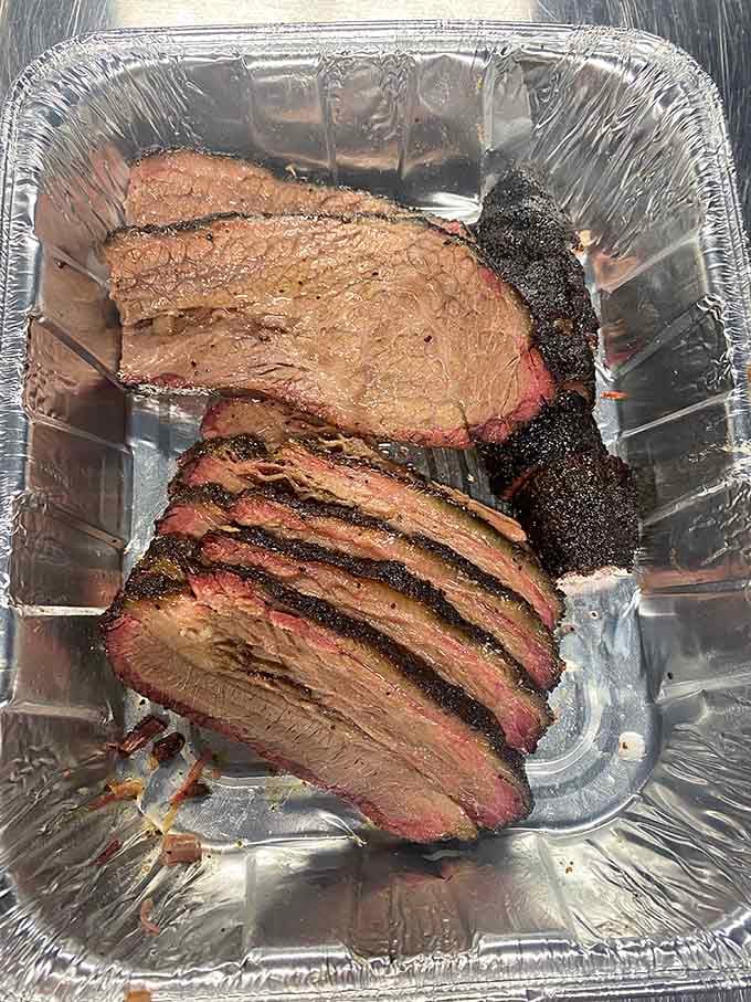 Look at that smoke ring and bark on those brisket slices, proof positive that low and slow isn't just a motto, it's a way of life.