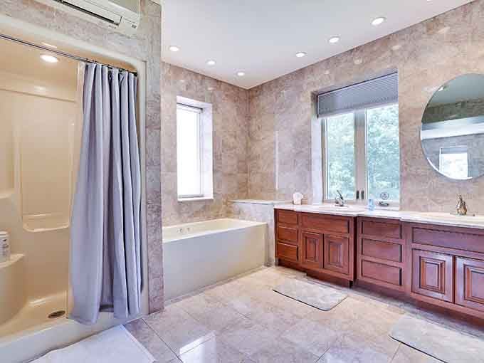 Spa-worthy bathrooms with soaking tubs make you feel like royalty preparing for the ball, minus the glass slippers.