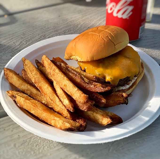That burger patty is so thick it probably has its own gravitational pull affecting nearby condiments.
